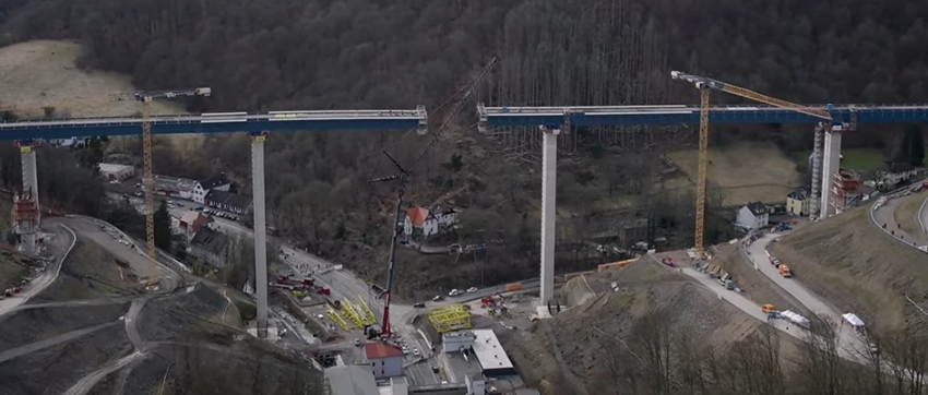 Steel composite viaduct takes shape above steep valley - Bridge Design ...