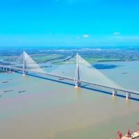 China opens river crossing with 1.2km main span - Bridge Design ...